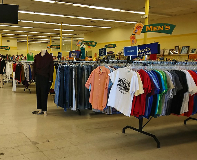 The men's department – where Hawaiian shirts and business casual live side by side like neighbors who wave but never really talk.