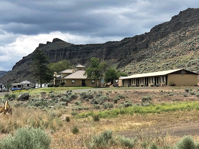 Winema Lodge nestled against dramatic cliffs – where "room with a view" takes on an entirely new meaning.