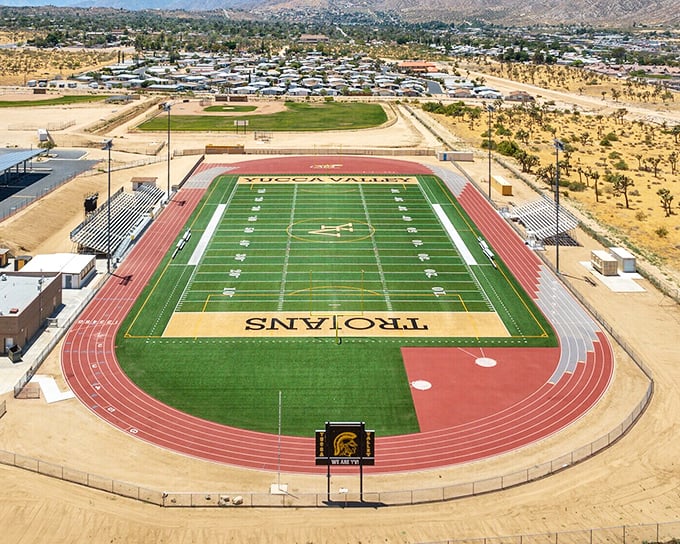 Friday night lights, desert style! Yucca Valley High School's pristine athletic facilities stand ready for the next generation of desert athletes and the community that cheers them on.