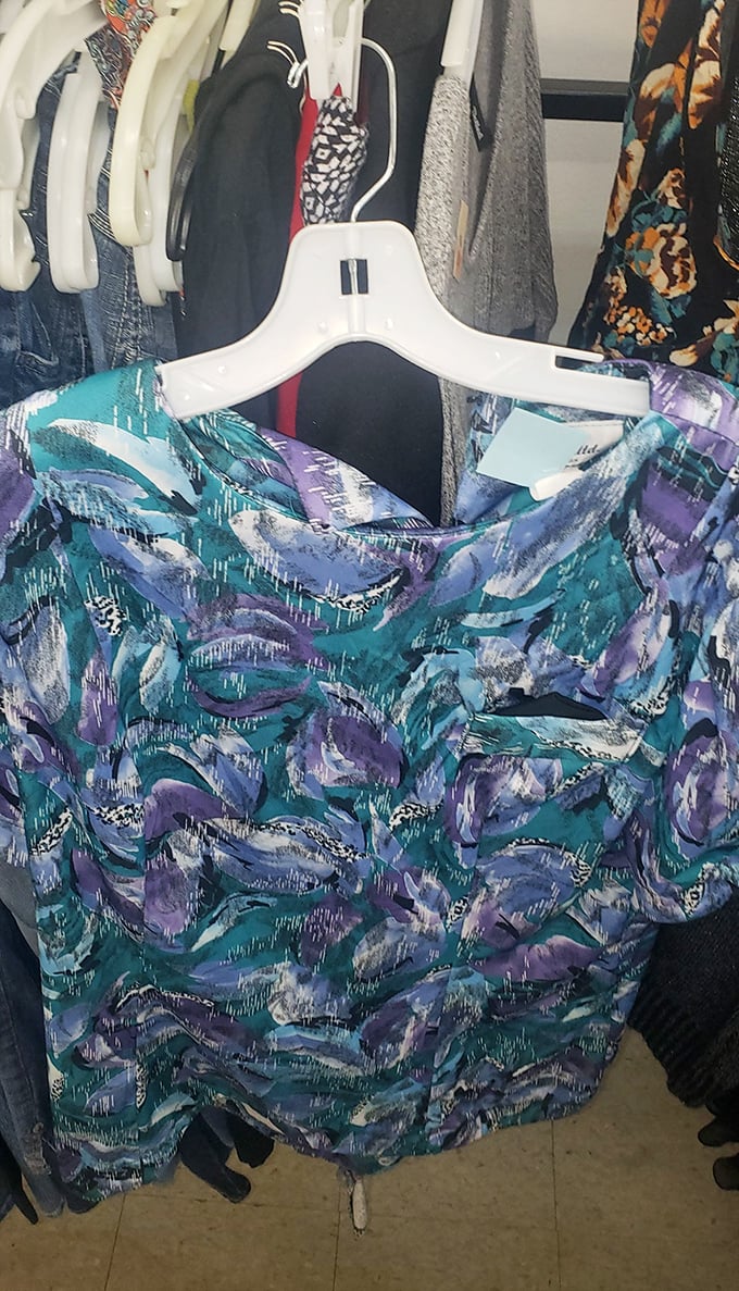 Abstract watercolor vibes on this blouse would make any art gallery docent proud – wearable creativity at a fraction of boutique prices.