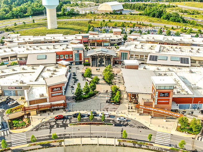 From above, the outlet's thoughtful design reveals itself—a masterpiece of retail architecture engineered to separate you from your money in the most pleasant way possible.