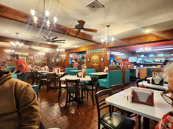 The ambiance says "come as you are" – ceiling fans spinning lazy circles over satisfied diners.