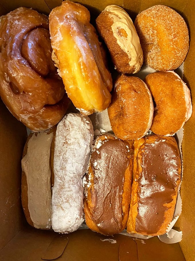 A box of Donald's isn't just breakfast—it's a choose-your-own-adventure of fried dough perfection that makes Monday mornings actually worth facing.