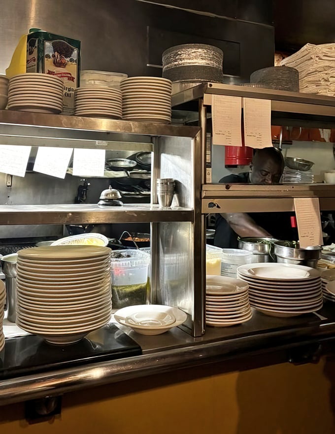 Behind every great meal lies organized chaos – stacked plates ready for culinary magic to happen.