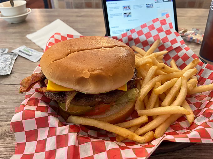 A burger that requires both hands and several napkins – the universal sign of something worth every delicious, messy bite.