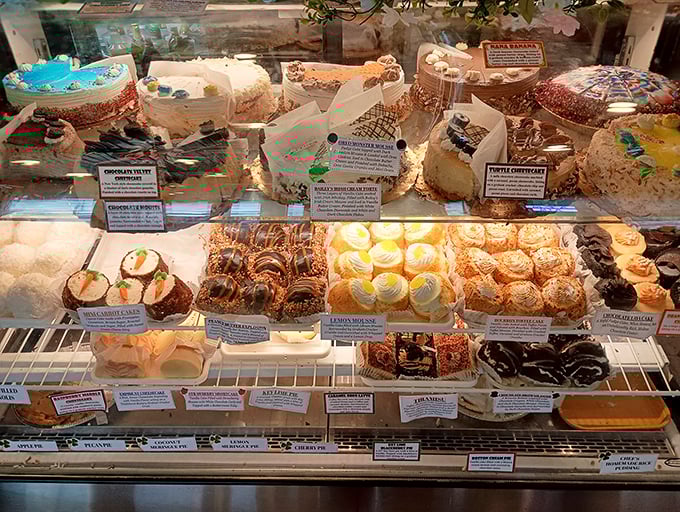 The dessert case – where willpower goes to die. Each cake and pastry silently whispering, "Diet? What diet? We don't know her."