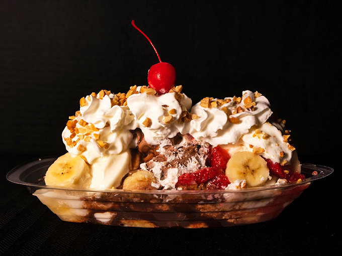 A banana split that doesn't know the meaning of restraint—where ice cream, fruit, whipped cream, and nuts come together in sweet, reckless abundance.