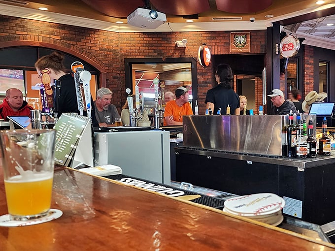 The bar area buzzes with that perfect blend of energy and relaxation – where strangers become friends over shared stories and cold drinks.