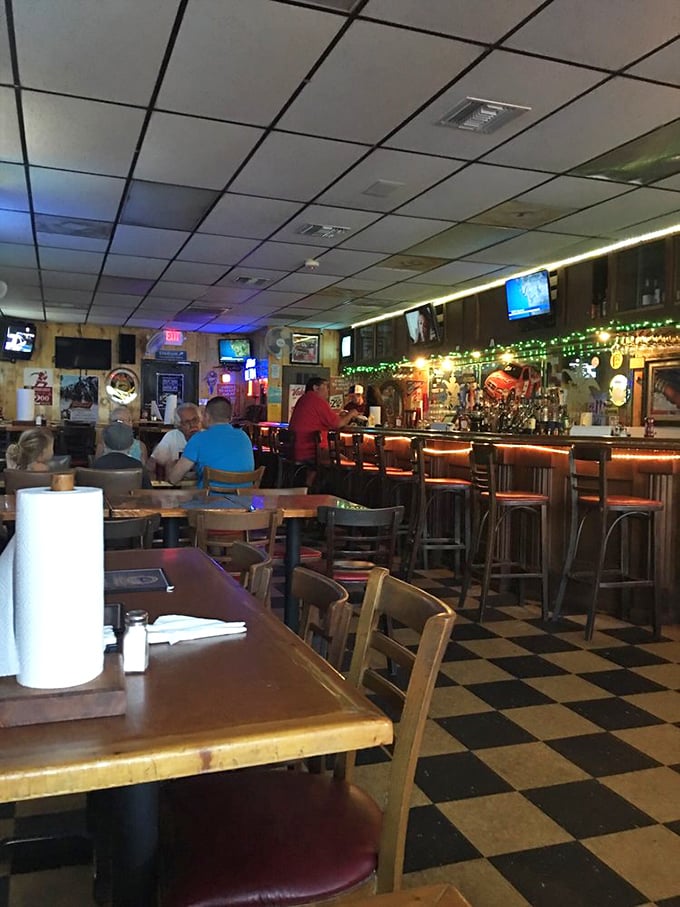 The bar area—where strangers become friends over shared rib recommendations and debates about which wing sauce deserves the championship belt.