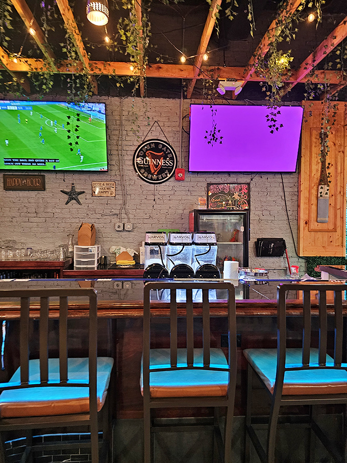 The well-stocked bar area creates a sports-friendly atmosphere where cold drinks meet hot, spicy seafood perfectly.