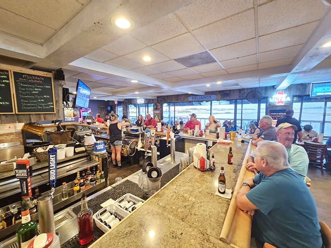 The bar – where locals tell fishing stories that grow taller with each drink, and nobody minds one bit.