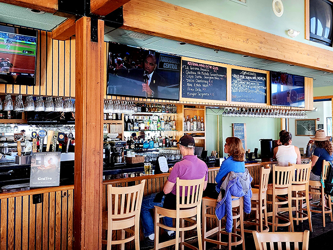 The bar area—where locals and tourists alike gather to swap fish tales that grow bigger with each perfectly mixed cocktail.