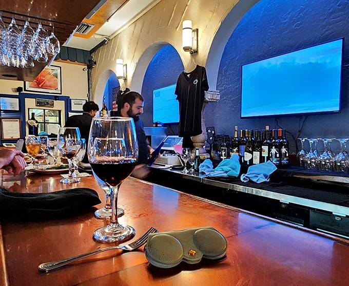 The bar area – where wine glasses await their moment to complement whatever oceanic delight you've wisely ordered.