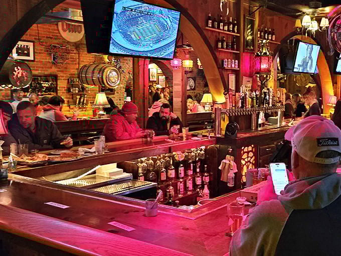 The bar area glows with a warm red light, beckoning you to pull up a stool and stay awhile – pizza paradise awaits.