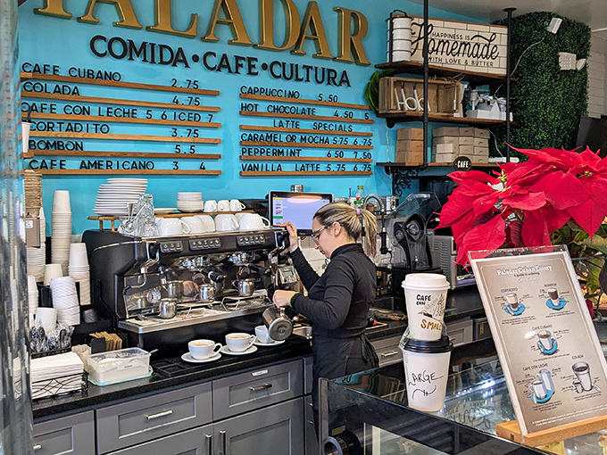 Behind that turquoise wall, baristas craft liquid happiness, proving that coffee isn't just a drink – it's a warm, caffeinated hug.