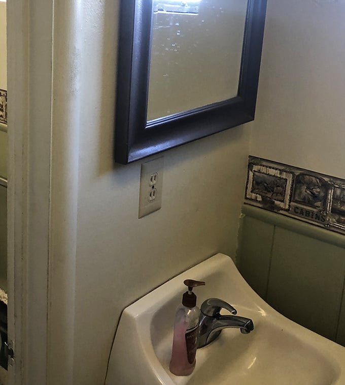 Even the bathroom maintains that classic diner aesthetic—no frills, just function, like a haiku written in porcelain and tile.