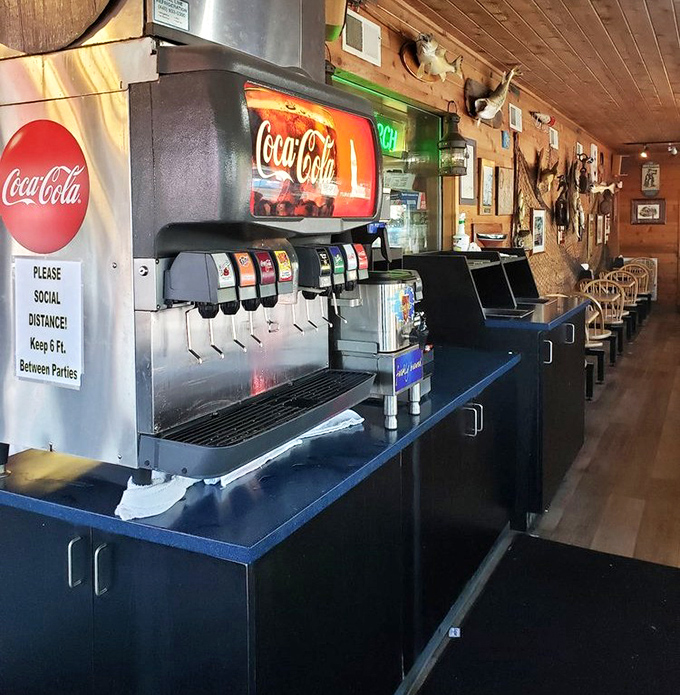 The soda station – where free refills flow as freely as the stories being shared at nearby tables.
