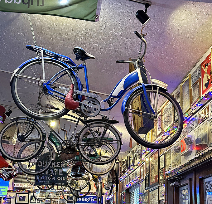 The bicycle collection hanging from the ceiling isn't just decoration—it's a gravity-defying museum. These two-wheeled treasures watch over diners like mechanical guardian angels.