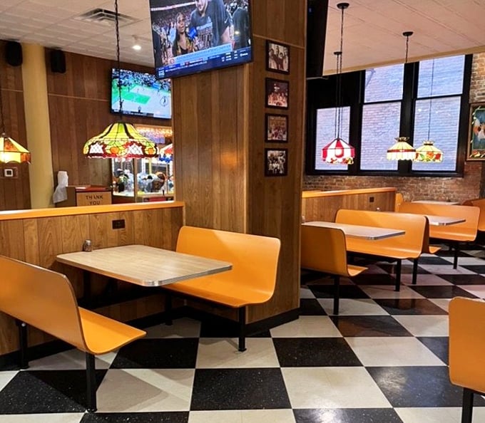 These orange booths have witnessed countless first dates, family dinners, and the silent prayer of gratitude before that first bite.