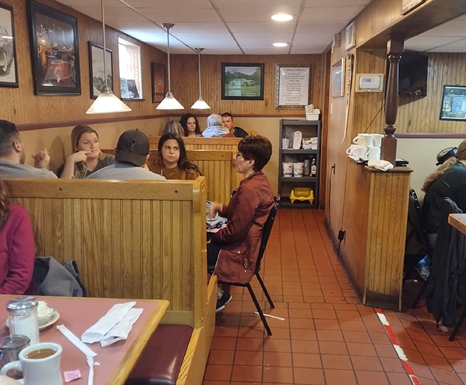 Families settling into booths like they're coming home – this is community dining at its finest.