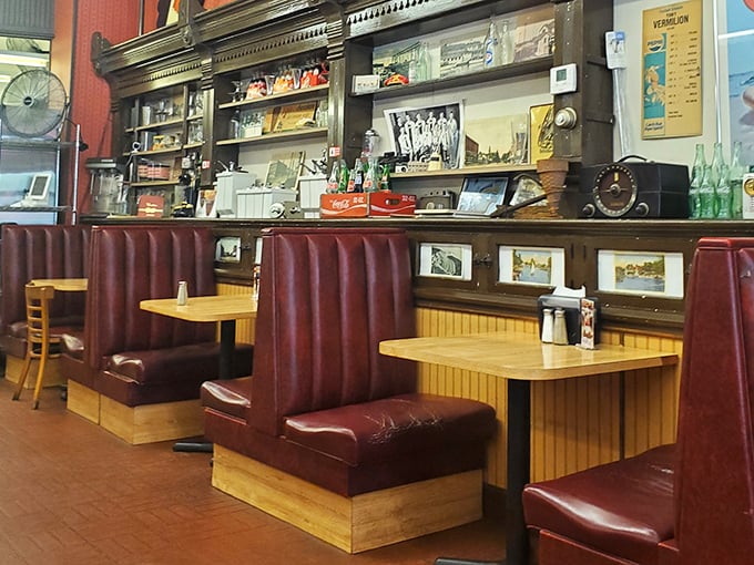 These burgundy booths could tell stories that would make a novelist jealous. Wood paneling and nostalgia—the perfect pairing. 