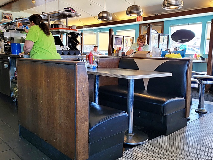 Cozy booths invite you to slide in and stay awhile, where every table comes equipped with the essential condiment quartet.