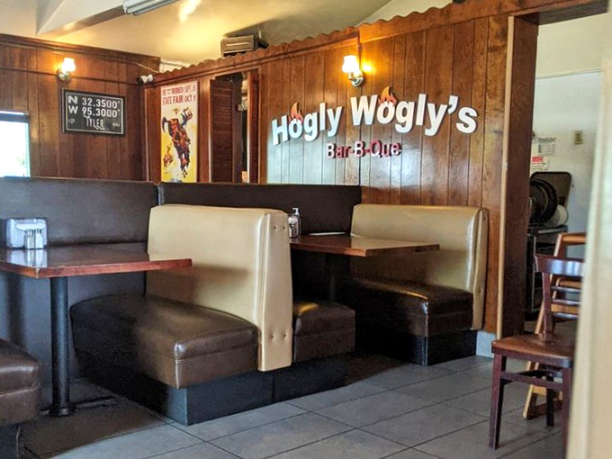 Booth seating arranged for optimal meat-to-mouth efficiency. The wood paneling isn't retro—it's timeless, just like the recipes.
