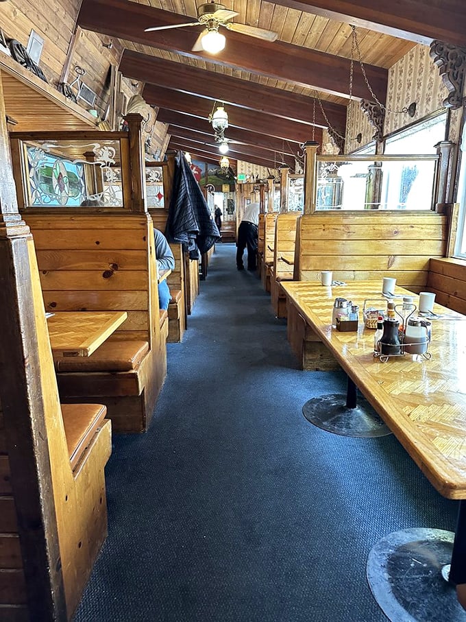 The dining room's wooden booths offer semi-private dining nooks—perfect for plotting your day's adventures or recovering from yesterday's.