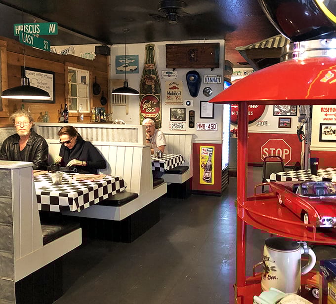 Booths lined with wood paneling and nostalgic decor create little islands of conversation amid the breakfast buzz.