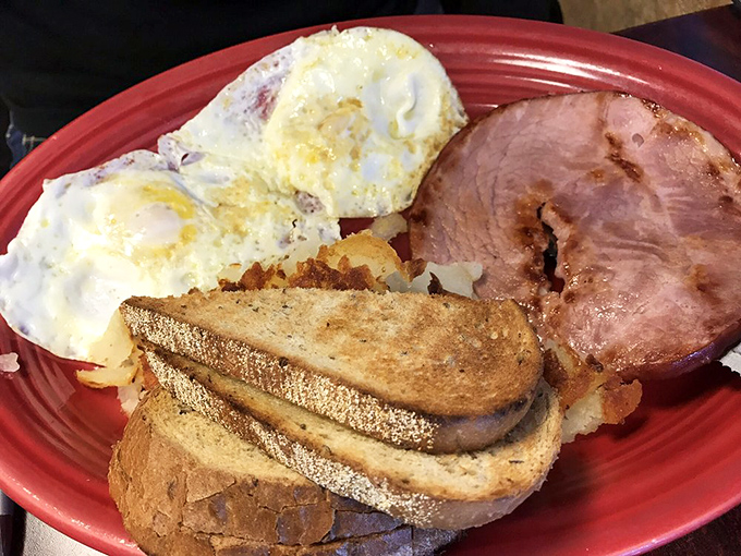 The breakfast platter that answers the eternal question: "Why choose one thing when you can have it all?" Eggs, meat, toast – the morning trifecta.