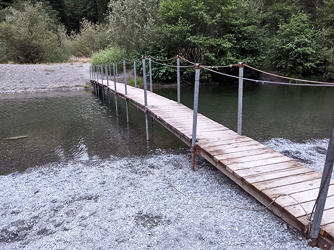 This simple wooden bridge invites you to cross over—both literally and metaphorically—into a world where deadlines and emails cease to matter.
