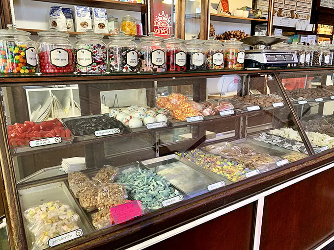 The candy counter—where self-control goes to die and childhood memories come flooding back with every colorful jar.