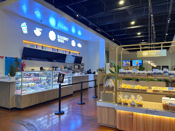 The modern interior gleams with possibility—glass cases filled with treasures more valuable than any jewelry to a serious foodie.