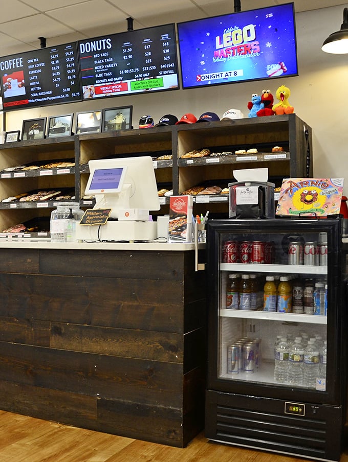 The counter area combines rustic charm with donut efficiency—where transactions are quick but the memories will last much longer.