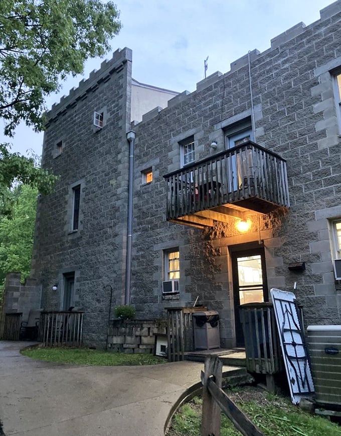 The castle's side entrance reveals thoughtful details—ornate lighting fixtures and balconies that transport you straight into a medieval daydream.