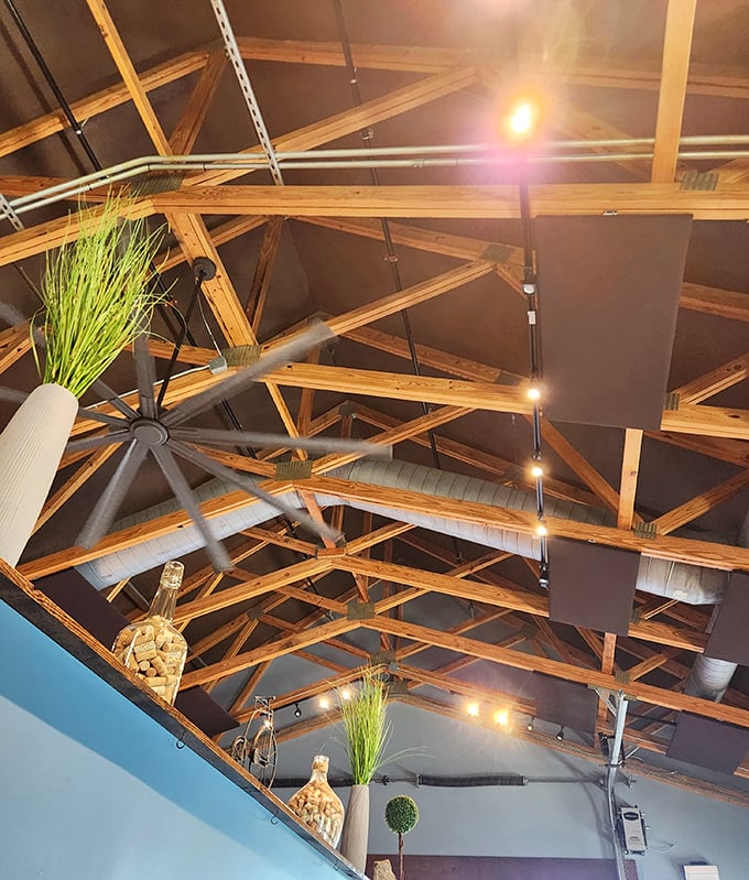 Architectural eye candy above – exposed wooden beams and thoughtful lighting create an atmosphere that's simultaneously rustic and refined.