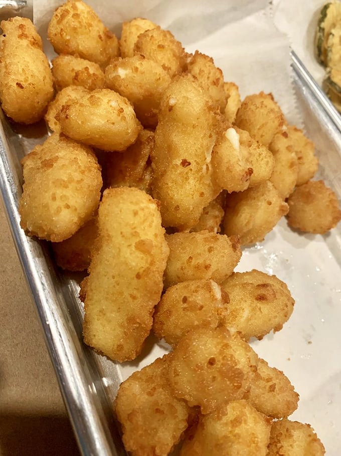 These cheese curds aren't just fried—they're transformed into golden nuggets of happiness that make Wisconsin proud from 1,200 miles away.