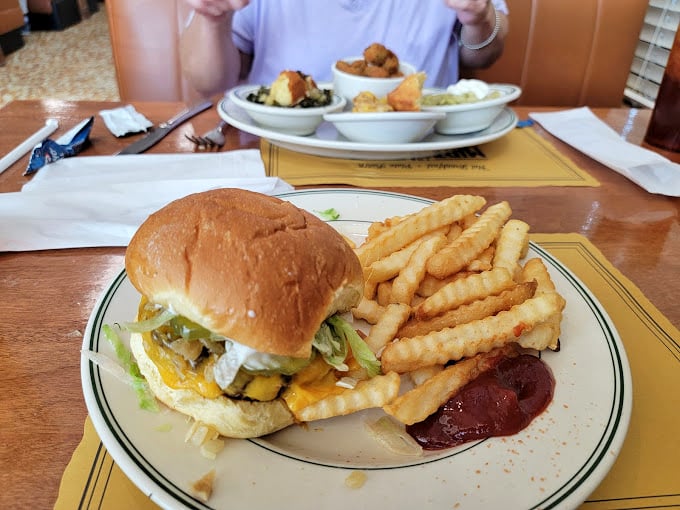 A proper diner burger doesn't need fancy aioli or artisanal buns—just honest ingredients, proper seasoning, and fries that snap like twigs in autumn.