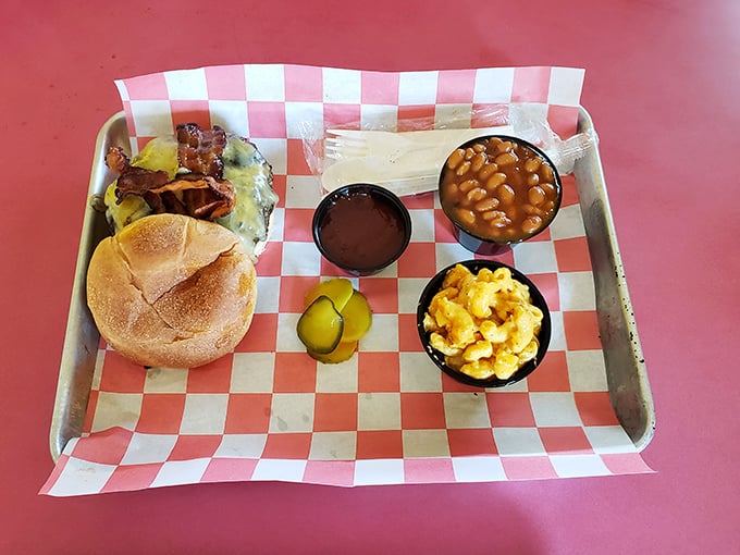 A sandwich that requires both hands and several napkins—pulled pork piled high with no pretense, just pure barbecue satisfaction.