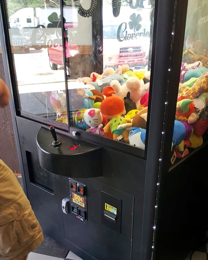 The claw machine – where kids' dreams and parents' quarters disappear with equal speed. A diner tradition as essential as the coffee refill.