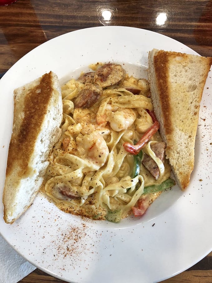Pasta that doesn't care it's at a seafood shack – loaded with shrimp and sausage, it's the unexpected star that makes indecisive diners breathe a sigh of relief.