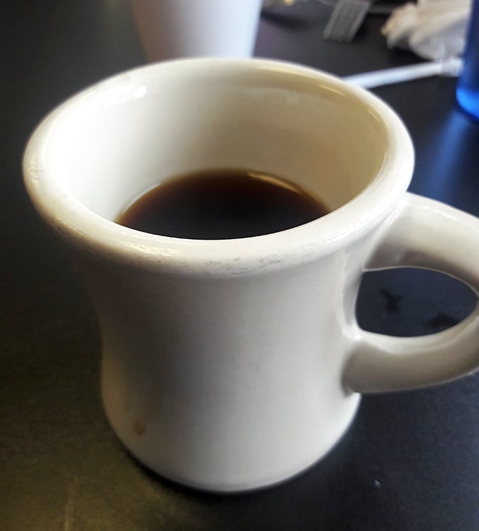 The humble diner mug – civilization's perfect delivery system for caffeine. No fancy latte art needed when the coffee itself is liquid courage.