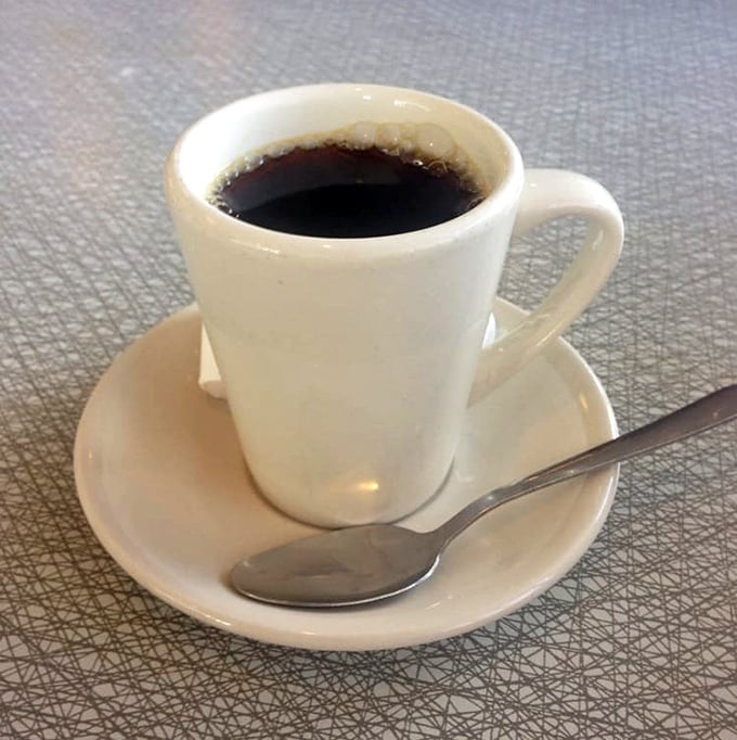 Just a simple cup of diner coffee—the unsung hero that's witnessed more life decisions, love stories, and deadline scrambles than any therapist in Georgia.