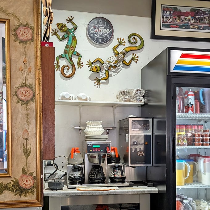 The coffee station, adorned with whimsical lizard art, serves as command central for morning revival operations.