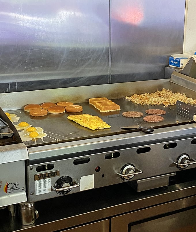 The flat-top grill – hallowed ground where breakfast dreams materialize before your eyes in a symphony of sizzles and spatula choreography.