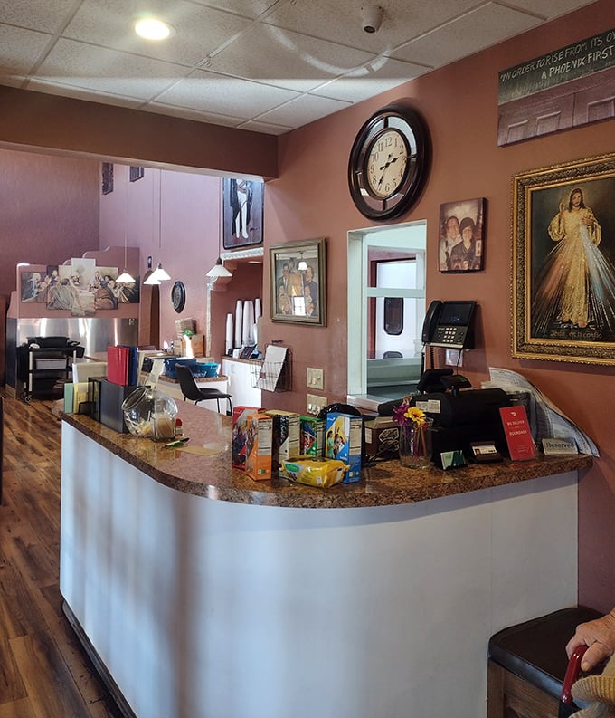 The heart of operations where orders become dreams and dreams become plates. Those religious icons aren't just decor—they're watching over the sacred recipes.