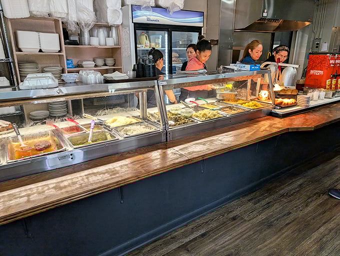 The cafeteria line—where decisions matter and regulars know exactly which day to come for their favorite dishes. Choose wisely, my friends.