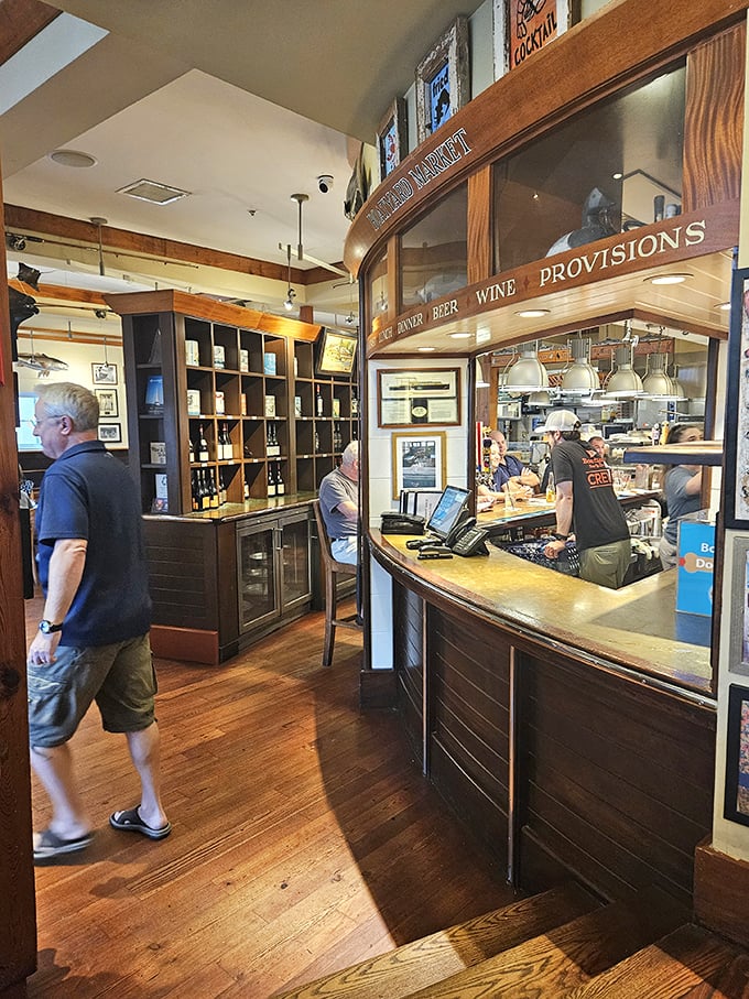 Peek behind the scenes at the ordering counter, where seafood dreams begin their journey from kitchen to eager palates.