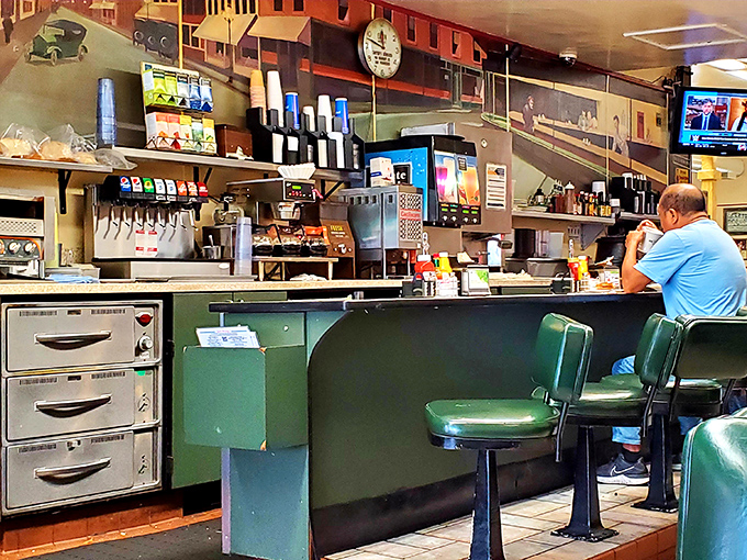The counter where breakfast dreams come true – a front-row seat to the symphony of sizzles and clanks that is diner percussion.