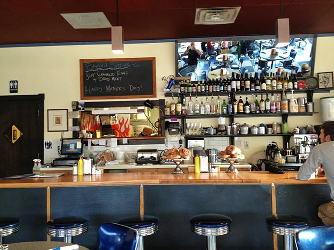 This isn't just a counter—it's command central, where breakfast dreams are dispatched with military precision and a side of small-town charm.
